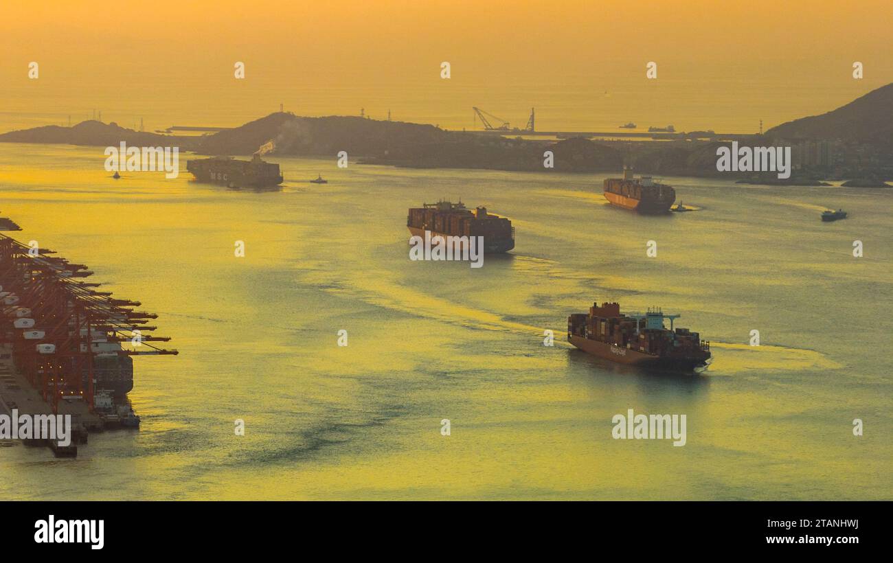 SHANGHAI, CHINA - DECEMBER 2, 2023 - A container ship prepares to dock ...