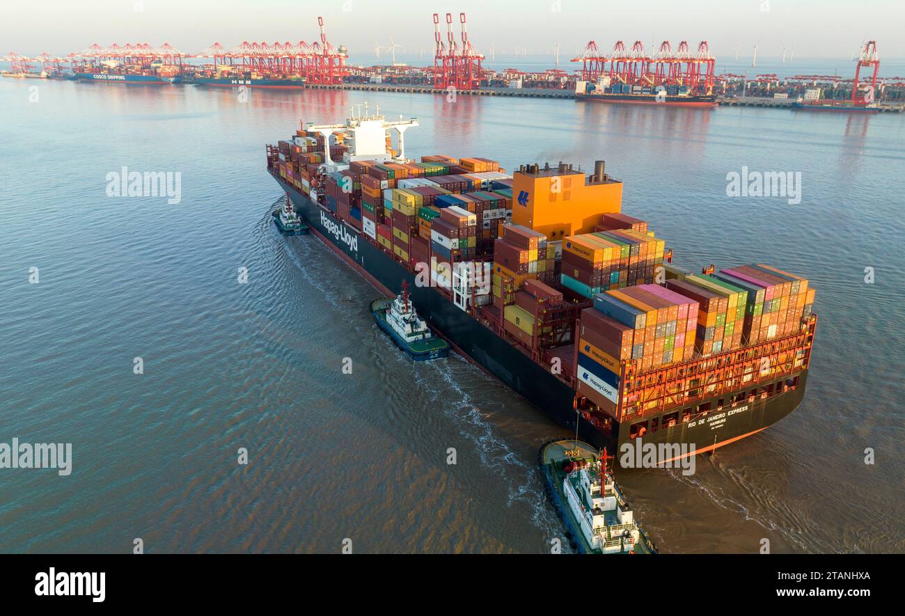 SHANGHAI, CHINA - DECEMBER 2, 2023 - A container ship prepares to dock ...