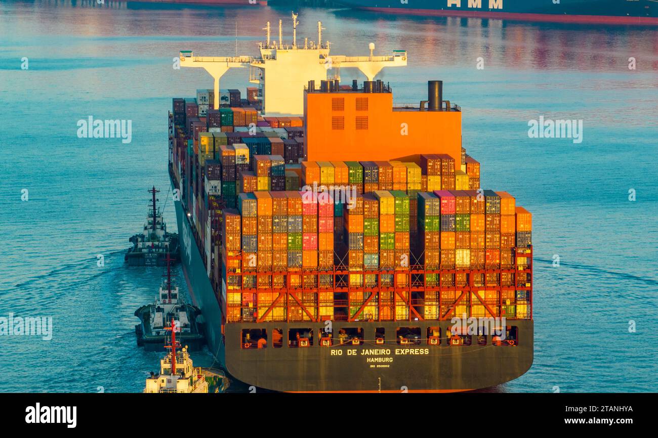 SHANGHAI, CHINA - DECEMBER 2, 2023 - A container ship prepares to dock ...