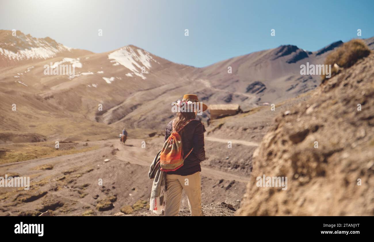traveler hipster girl in hat with backpack exploring sunny peruvian ...