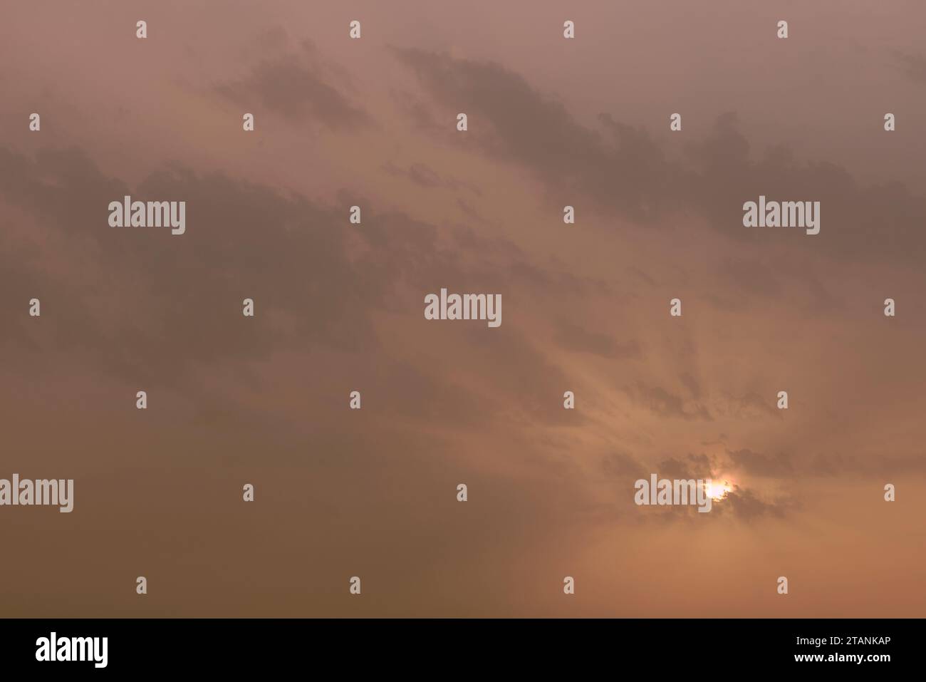 Sky, with diffused sun clouds colourful Stock Photo - Alamy
