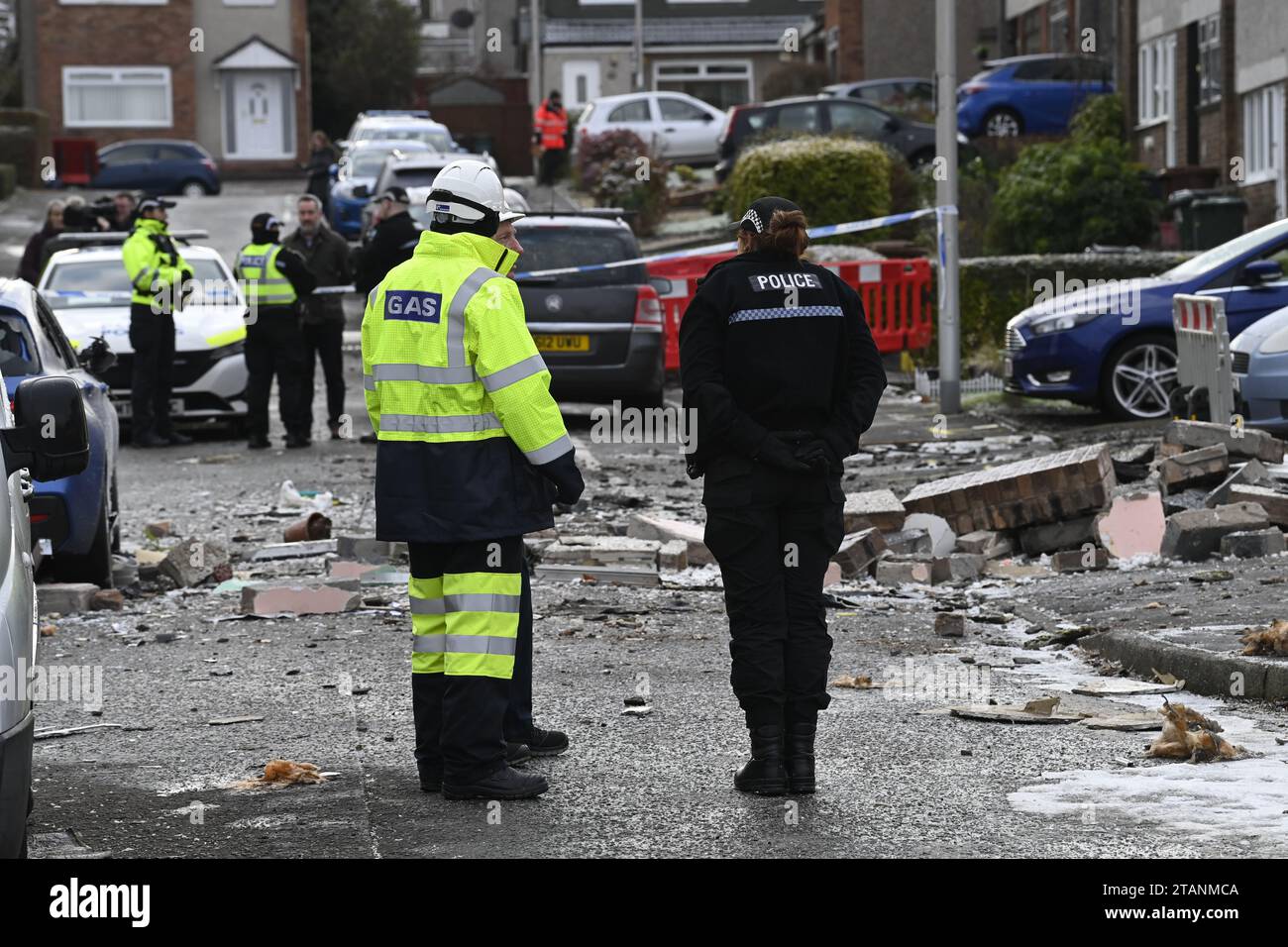Gas engineers and police officers at the scene on Baberton Mains Avenue ...