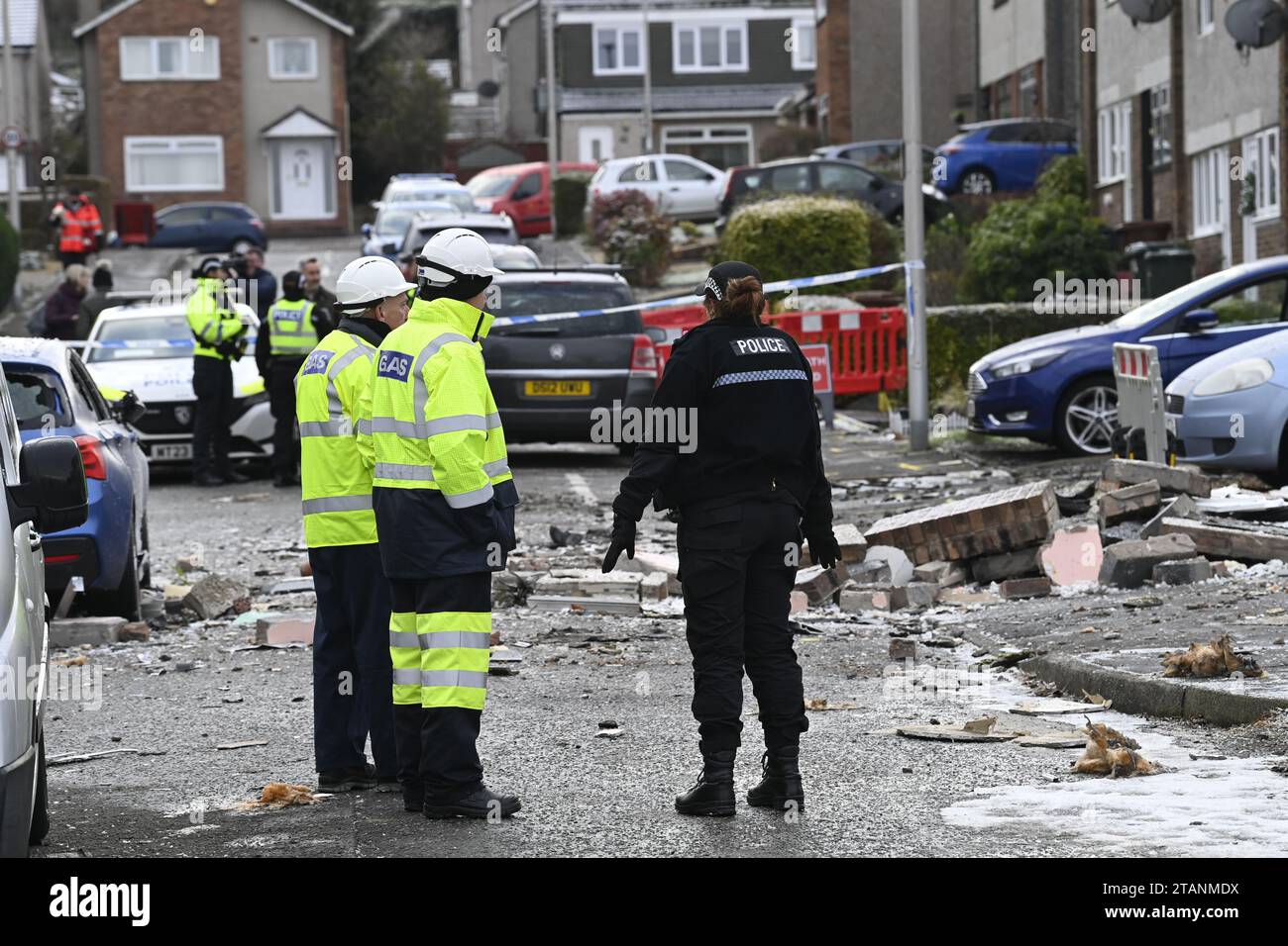Gas engineers and police officers at the scene on Baberton Mains Avenue ...