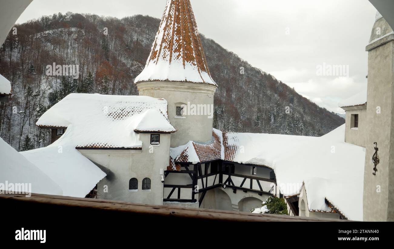 Roof tops and towers covered with snow in medieval castle at winter ...