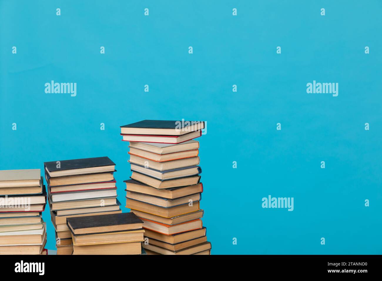 Stack of books on a blue background Library Education Stock Photo - Alamy