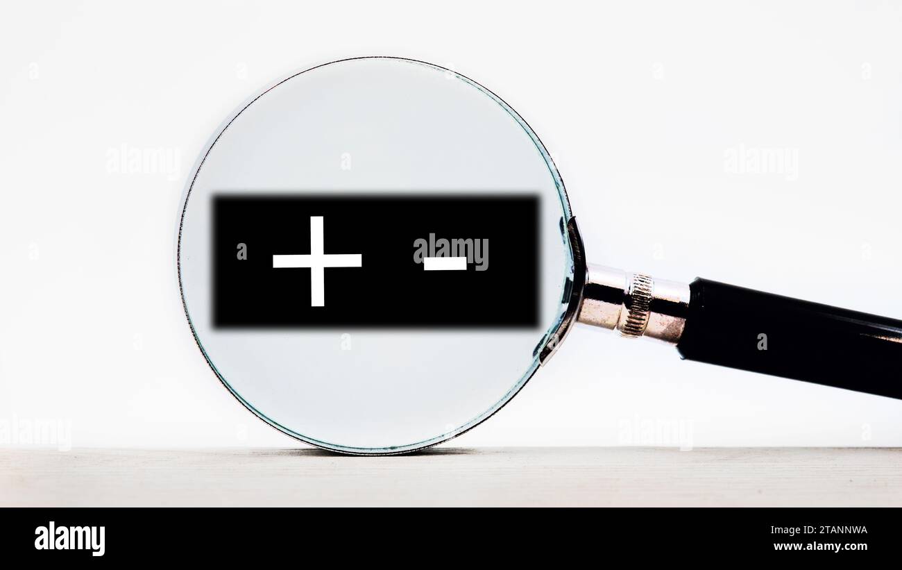 business concept.. Plus, minus symbols lettering on through a ...