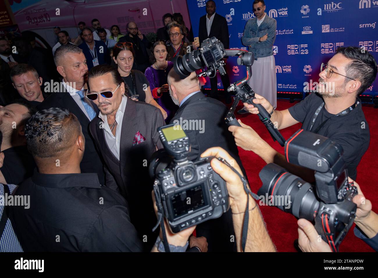 Johnny Depp, left, is surrounded by press as he attends the screening ...