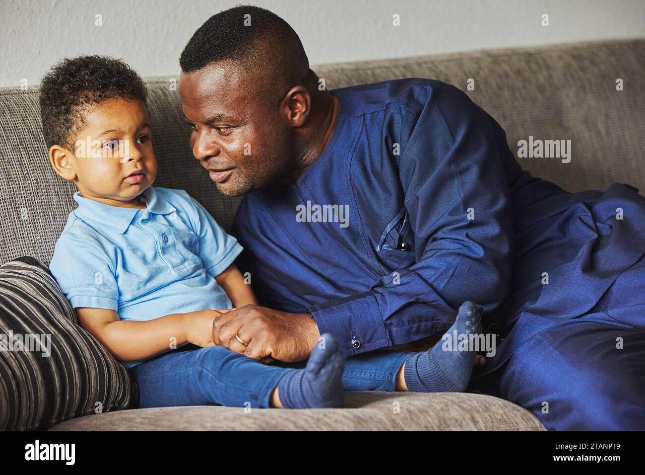 Tilst, Denmark, 12th of August: Father playing with son at home Stock ...