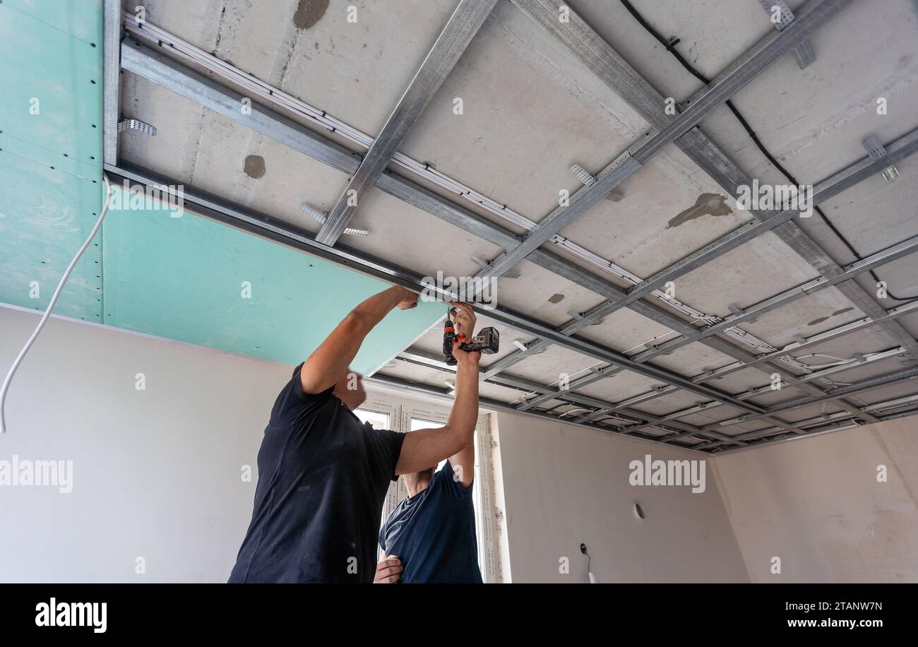 The construction workers doing the installation work for new ...