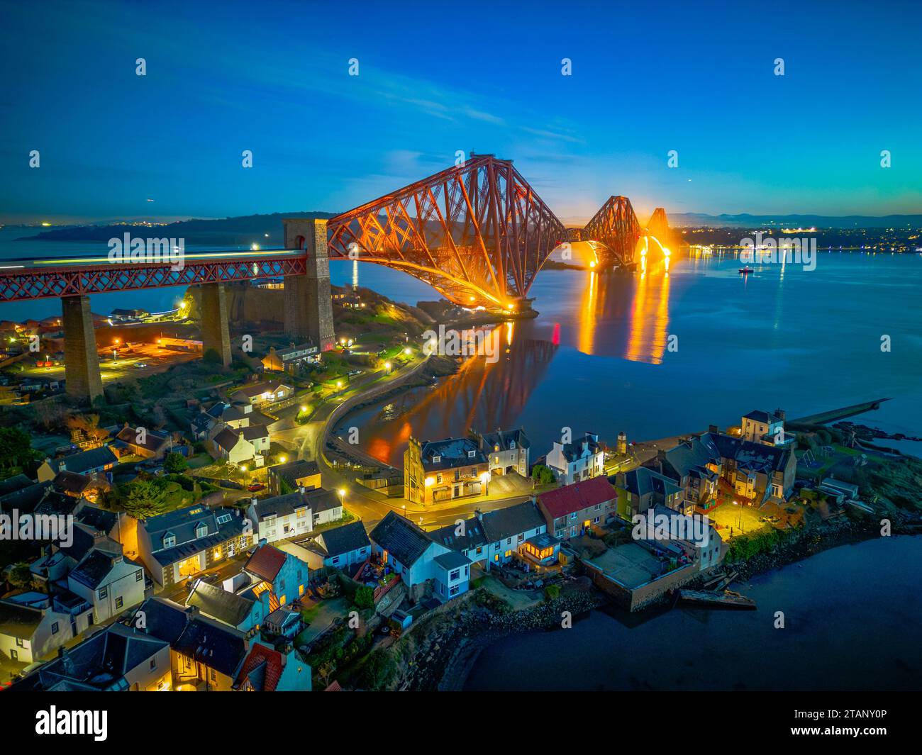 Aerial view from drone at night of North Queensferry village beside the ...