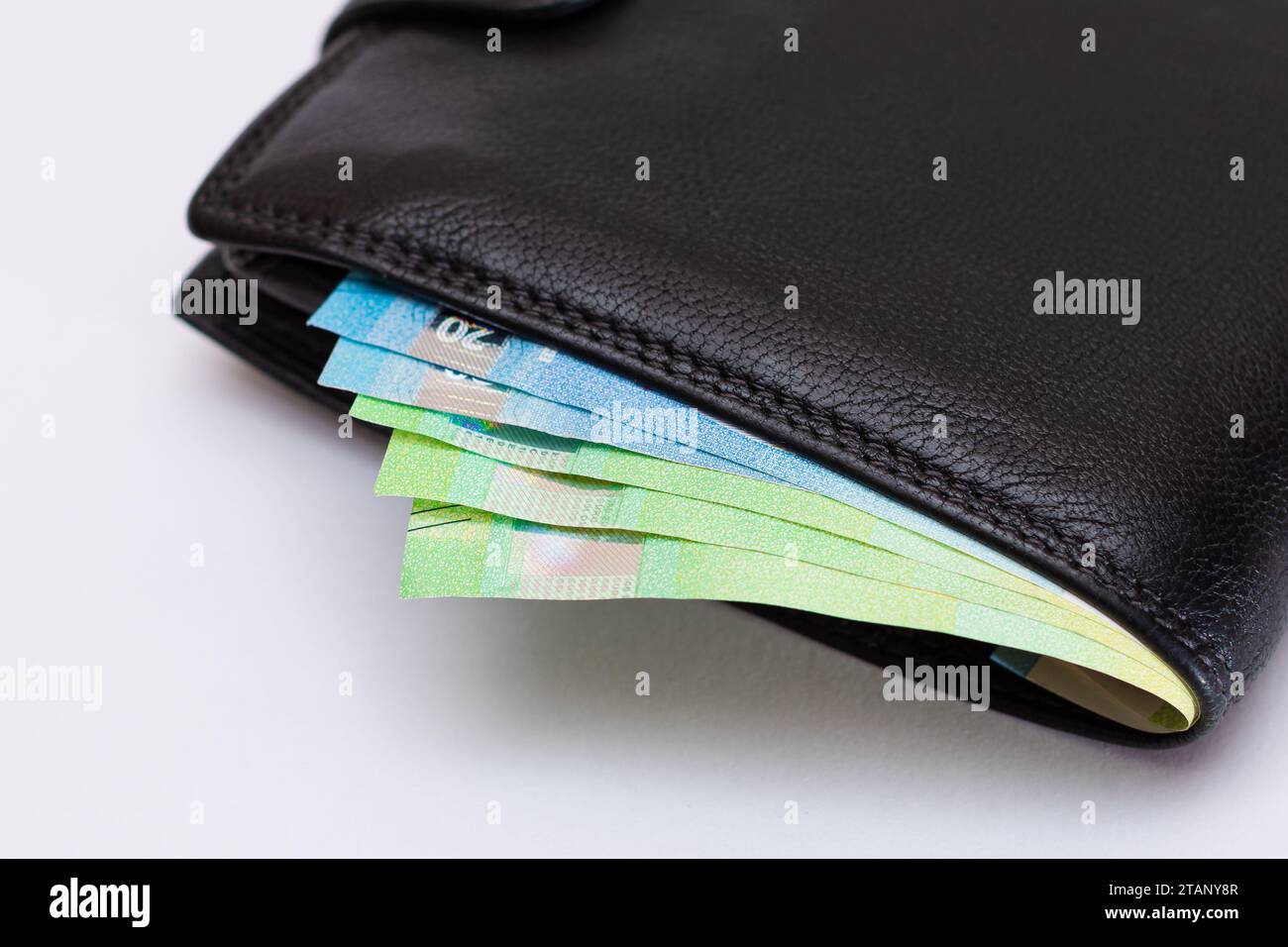 Black Leather Men Wallet with Euro Banknotes Inside on White Background ...