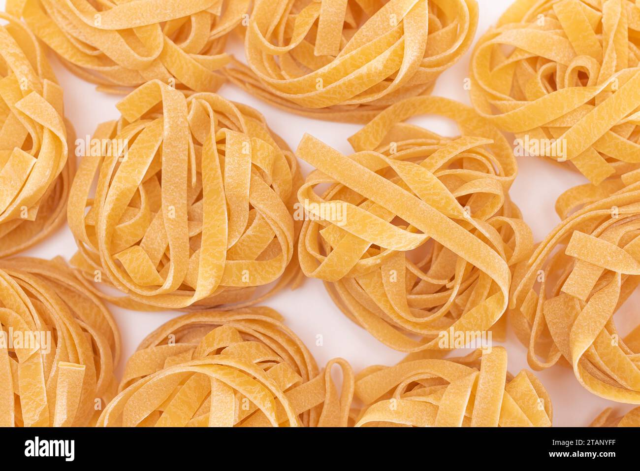 Scattered Classic Italian Raw Egg Fettuccine on White Table. Dry ...