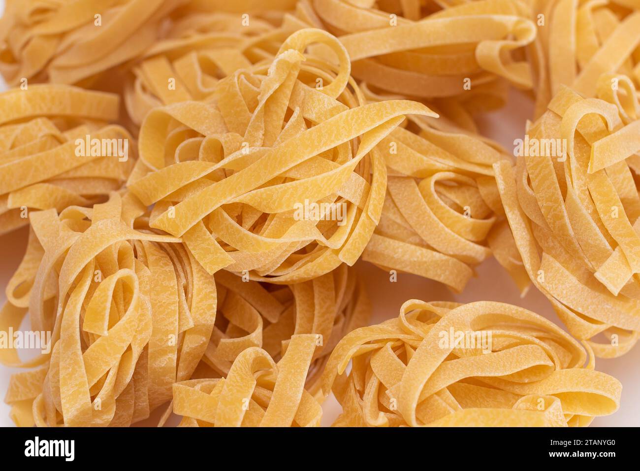 Scattered Classic Italian Raw Egg Fettuccine on White Table. Dry ...