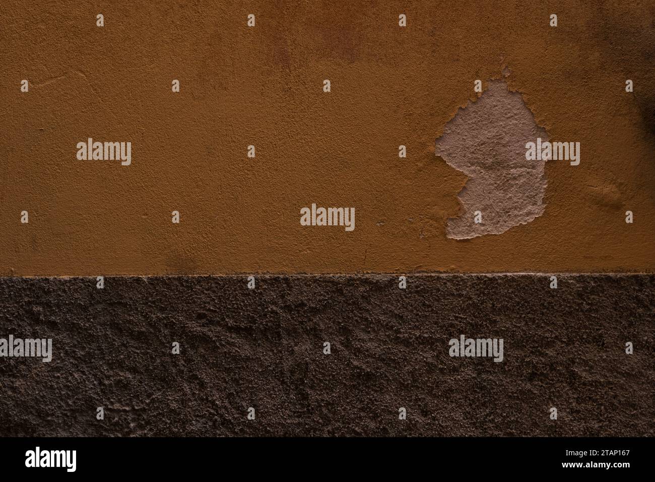 dark ocher plaster wall of old mediterranean city, texture background ...