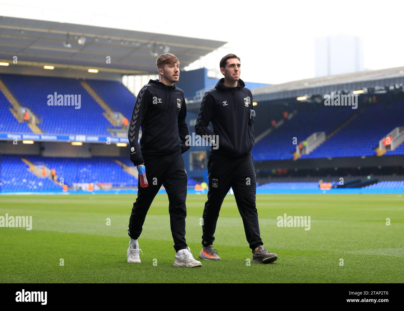 Coventry City's Josh Eccles (left) and Luis Binks inspect the pitch ...