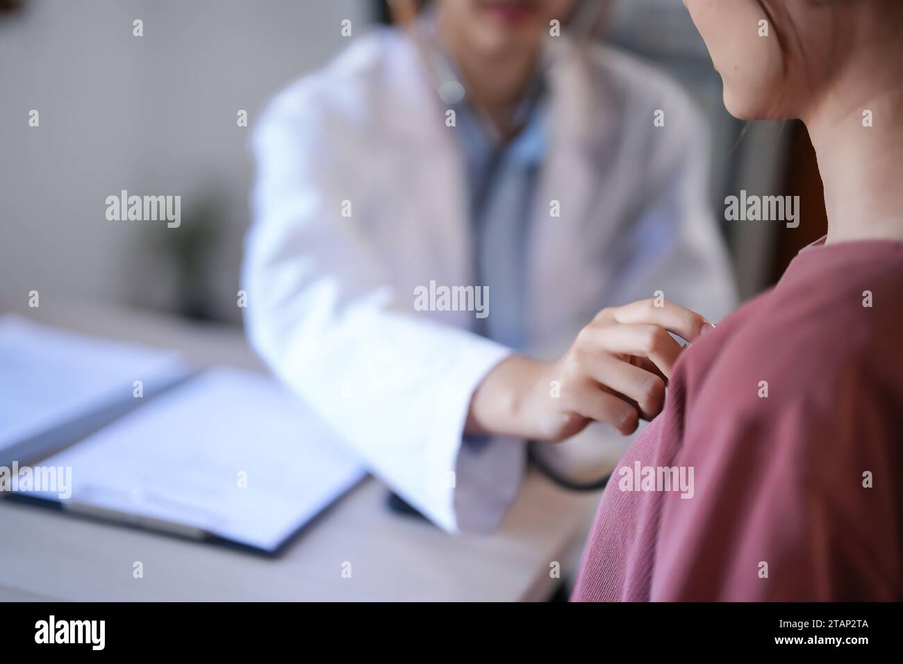 Asian psychologist women using stethoscope to check up patient and ...
