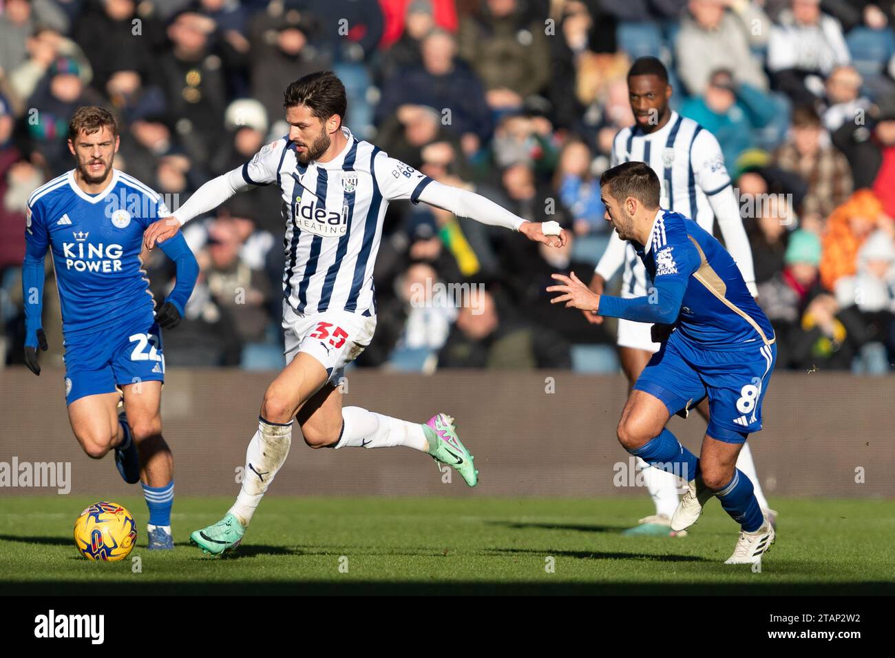 Okay Yokuslu of West Bromwich and Harry Winks of Leicester in action ...