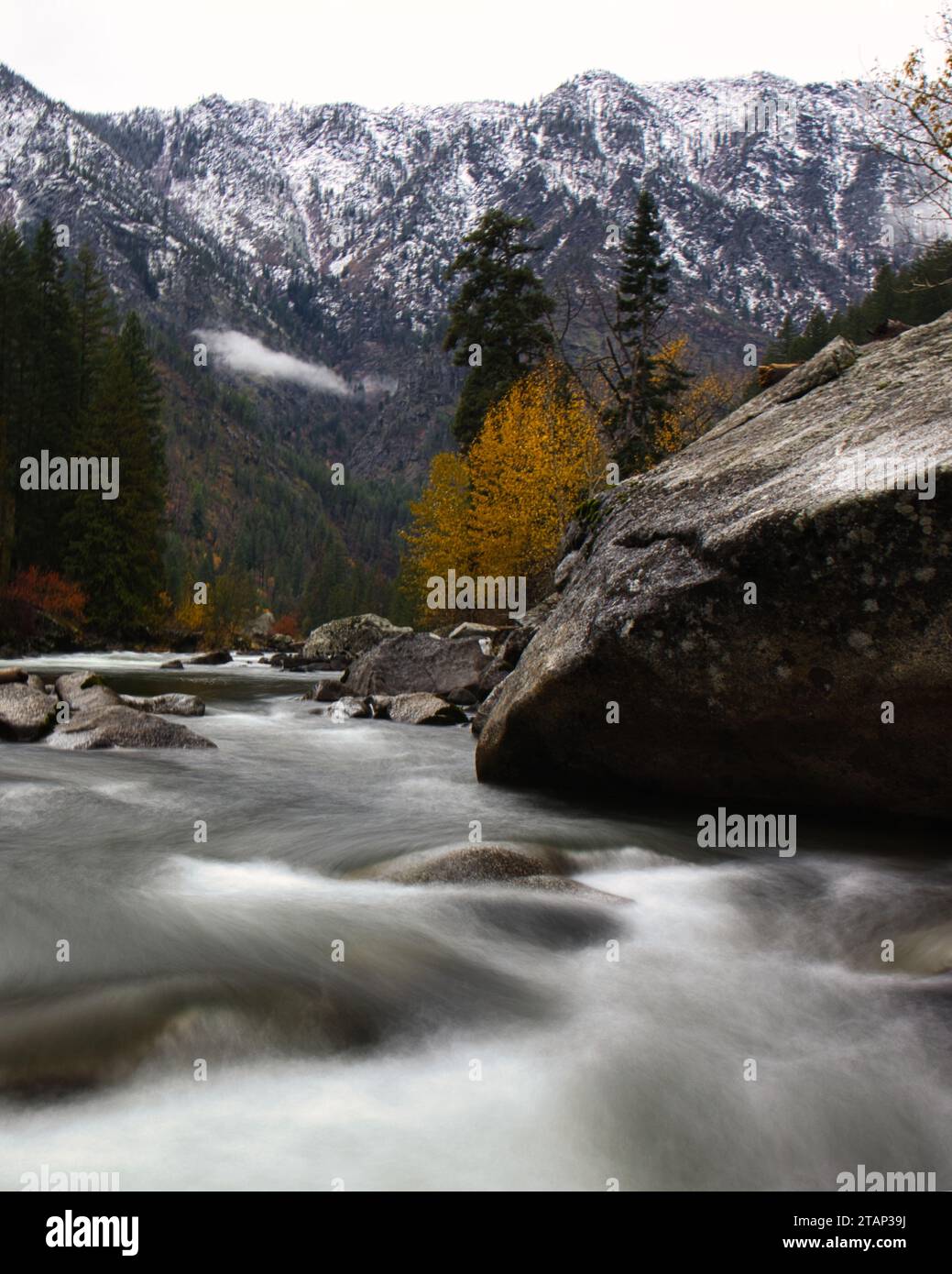 A scenic view of a rapid river with the North Cascade mountain range in the background Stock ...