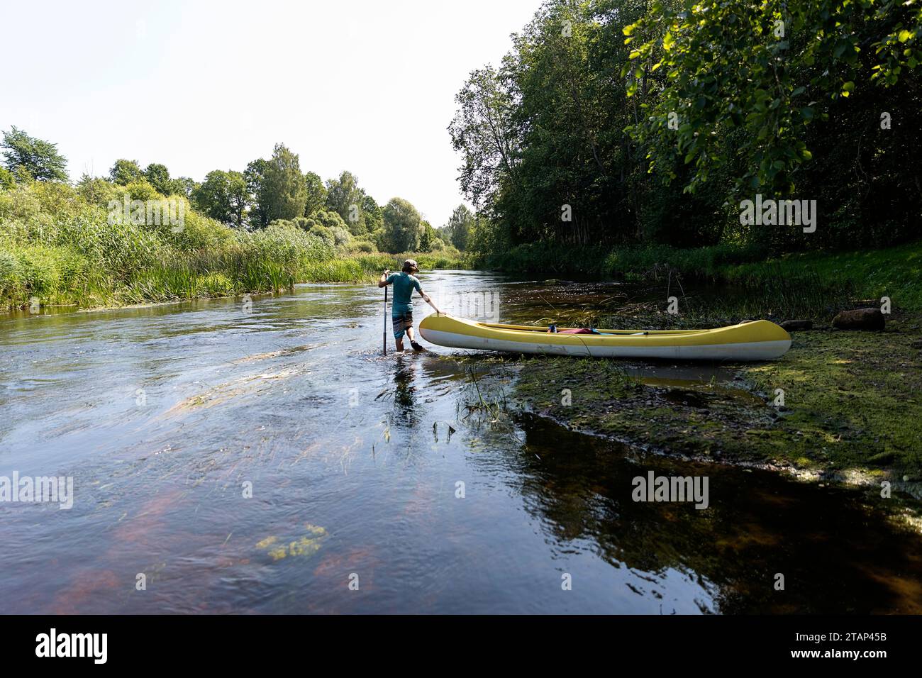 Tourist on a canoe, boat trip on Salaca river, exploring spectacular ...
