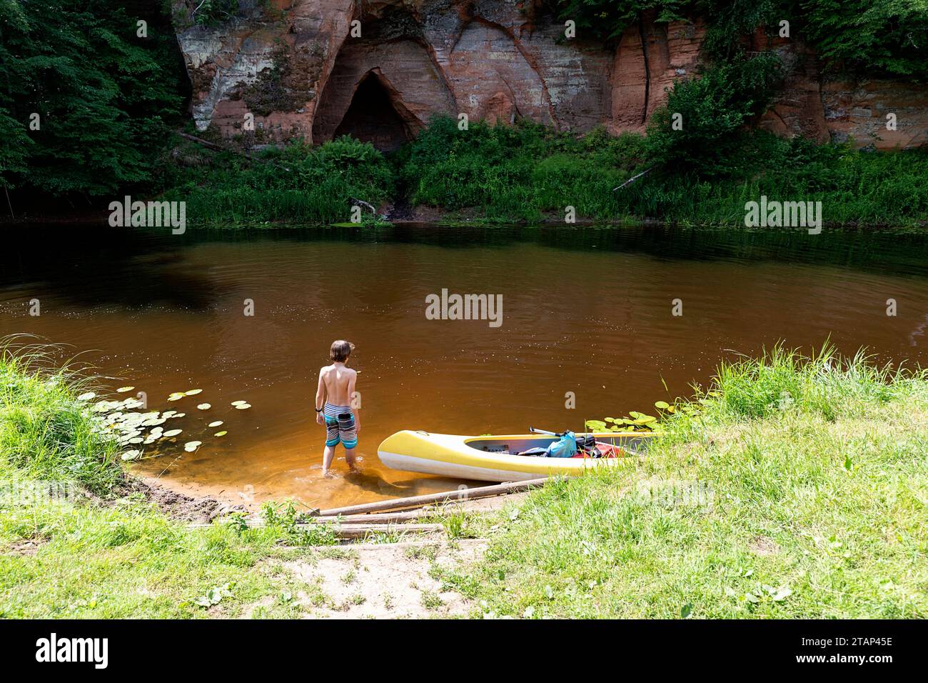 Tourist on a canoe, boat trip on Salaca river, exploring spectacular ...