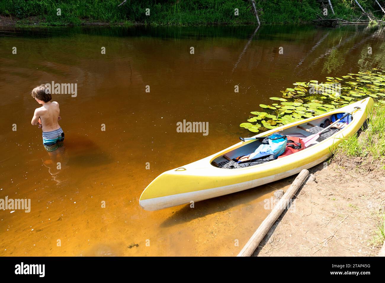 Tourist on a canoe, boat trip on Salaca river, exploring spectacular ...