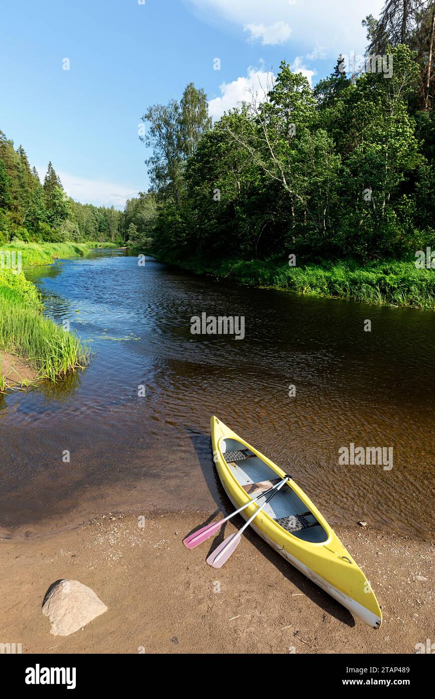 A canoe, boat on beautiful Salaca river, surrounded with spectacular ...