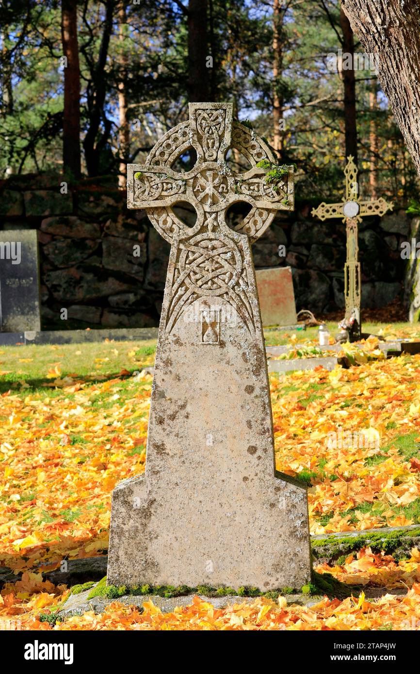 Celtic cross tombstone on cemetery, from early 1900s, in autumn ...
