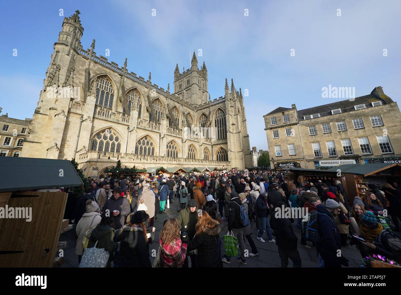 Members of the public attend a Christmas market in Kingston Parade ...