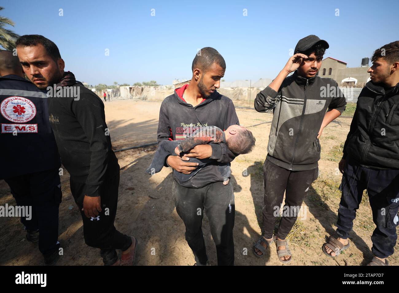 Palestinian search and rescue team and civilians gather to conduct ...