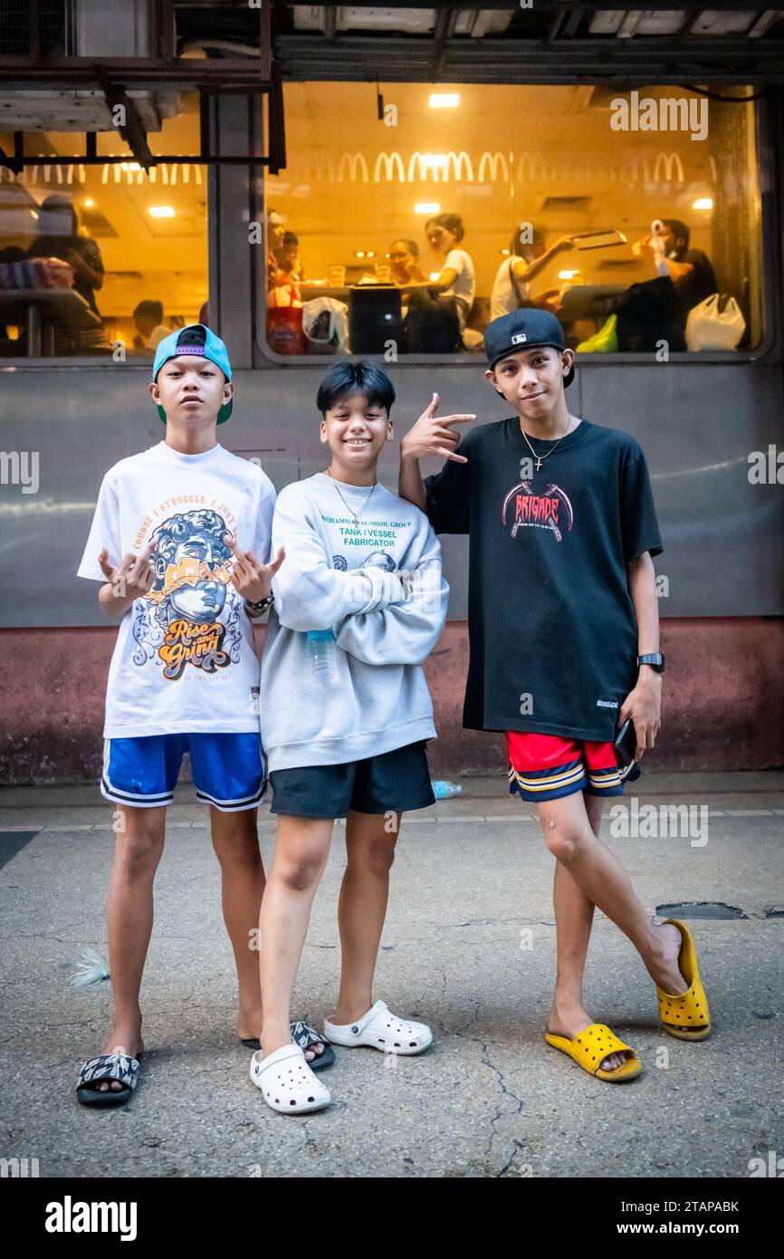 Three young teenage boys strike a pose in Manila, The Philippines Stock Photo - Alamy
