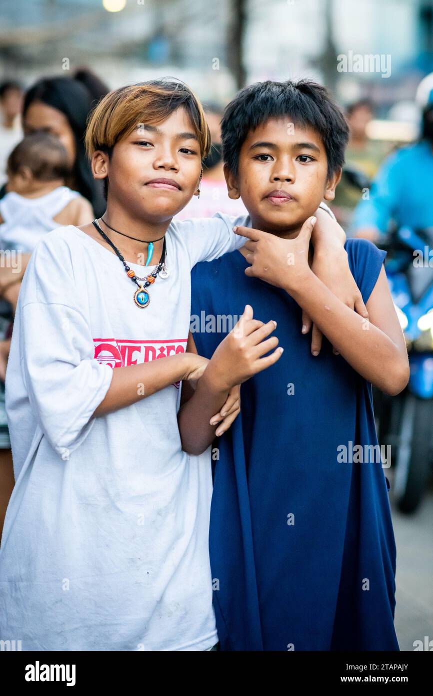 Two young boys strike a pose in Manila, The Philippines Stock Photo - Alamy