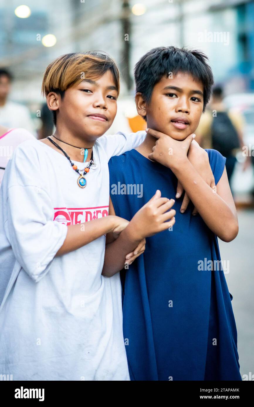 Two young boys strike a pose in Manila, The Philippines Stock Photo - Alamy