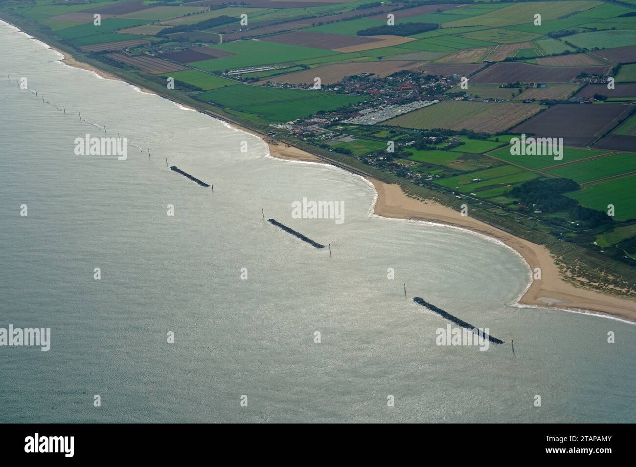 Aerial view of flood protection barrier reefs at Sea Palling, Norfolk ...