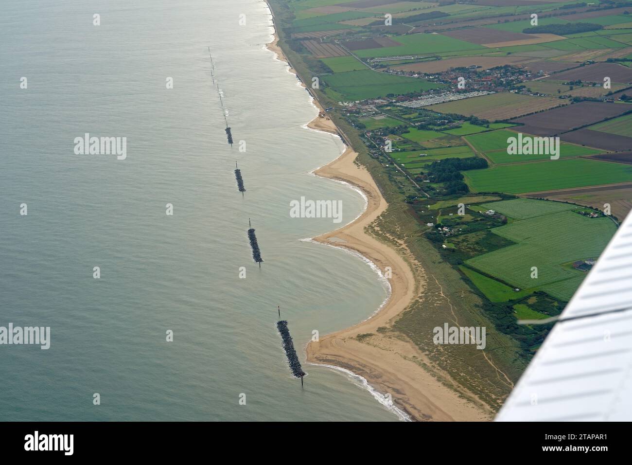 Aerial view of flood protection barrier reefs at Sea Palling, Norfolk ...