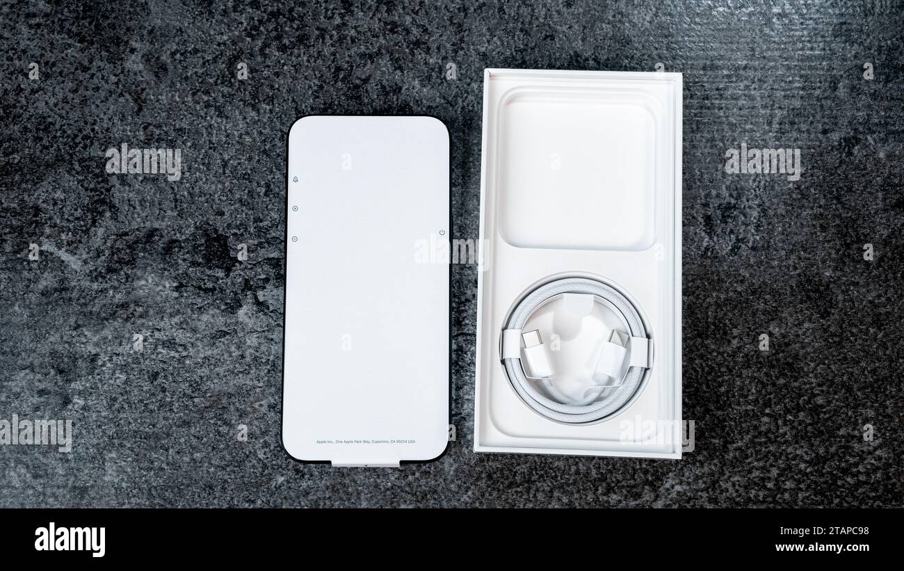 Jurmala, Latvia - 30 11 2023: unboxing of new smarphone apple iPhone 15 ...