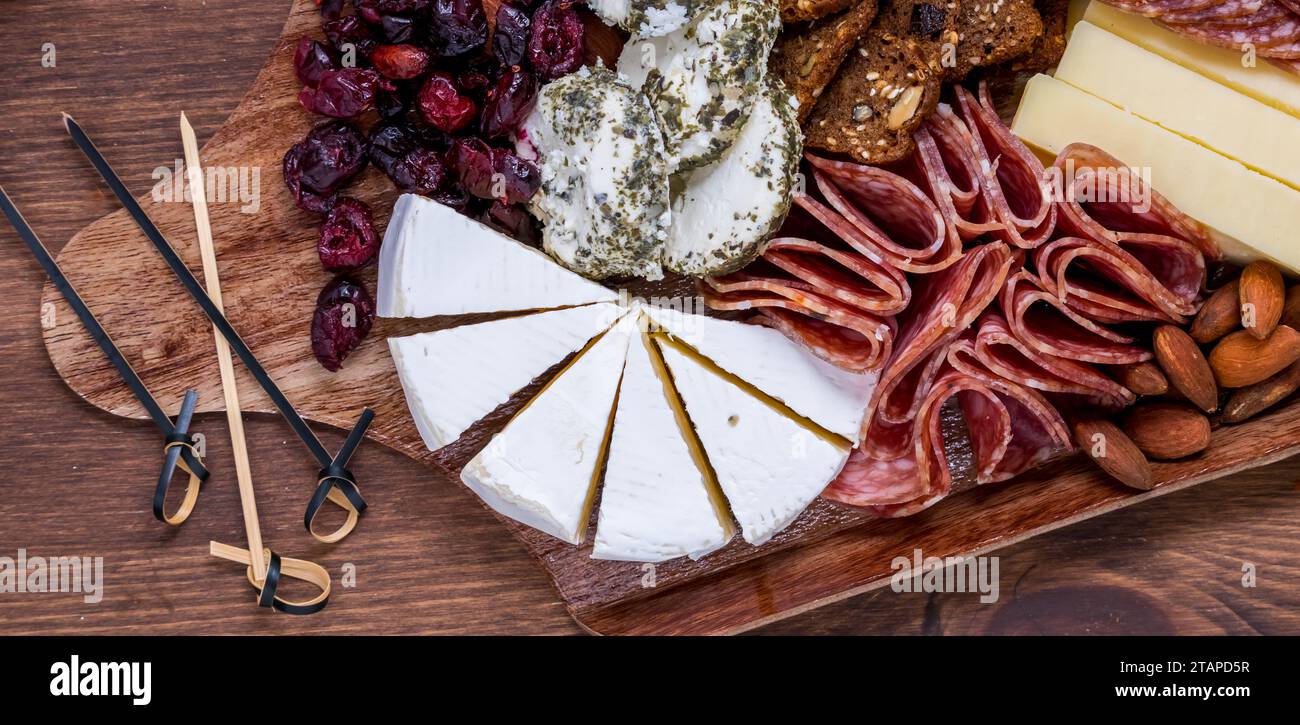 Cheese and meat charcuterie board for snacking Stock Photo - Alamy