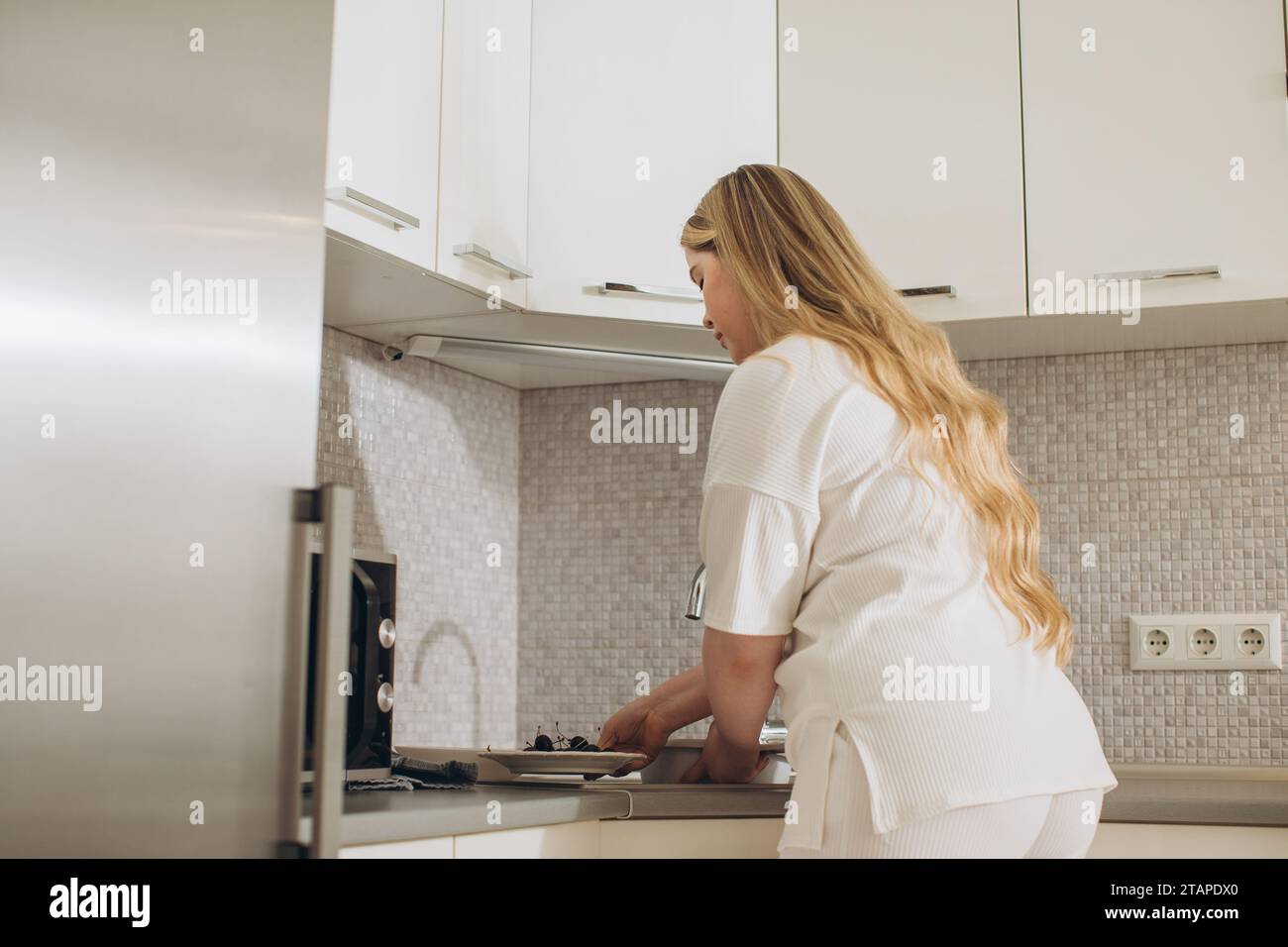 Woman washing fresh raw hi-res stock photography and images - Alamy
