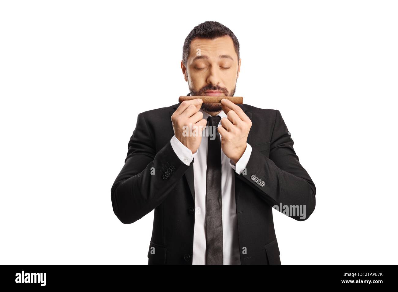 Man smelling a cigar isolated on white background Stock Photo - Alamy