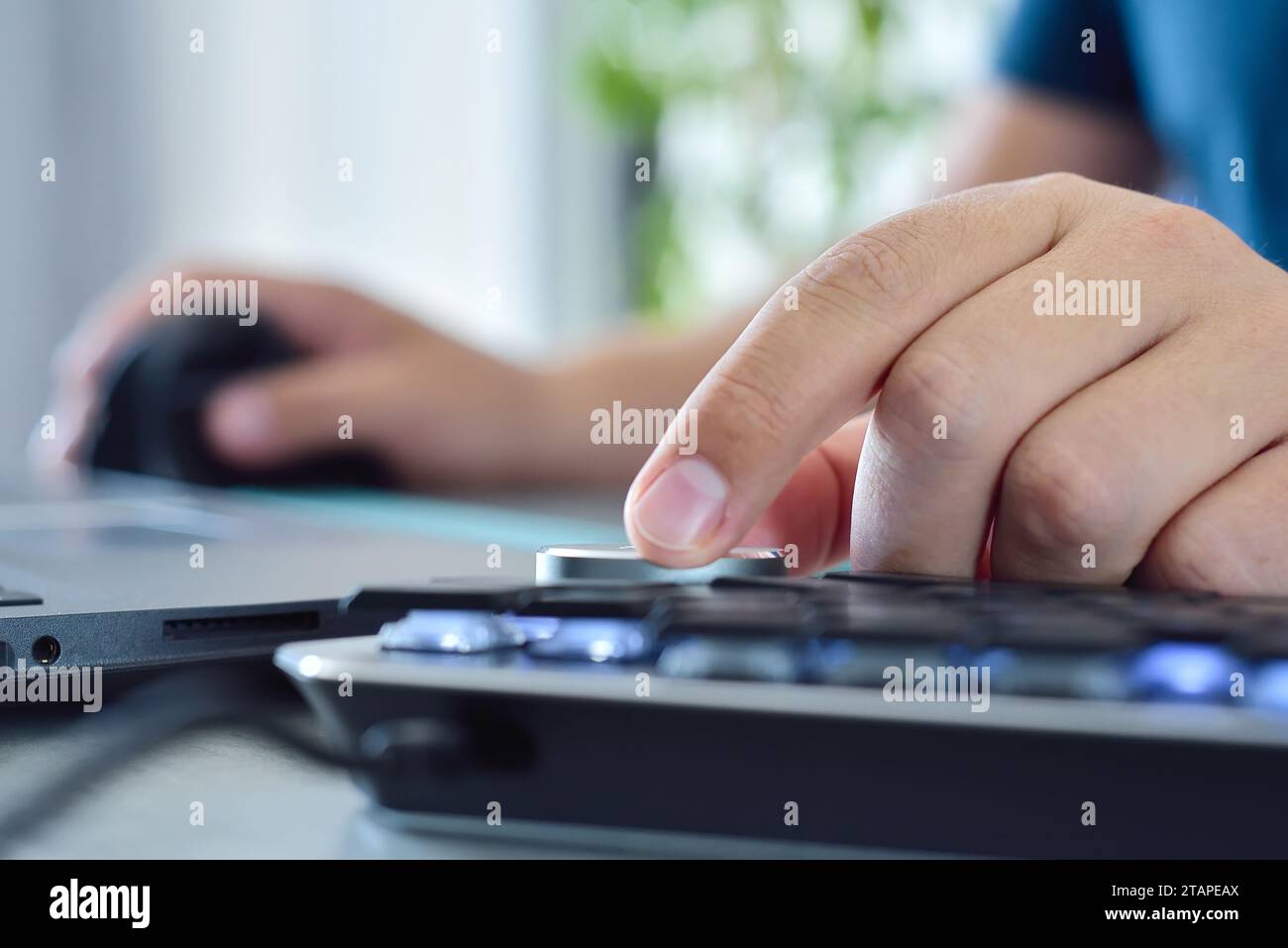 Designer hand working with wheel manipulator keyboard in home office ...
