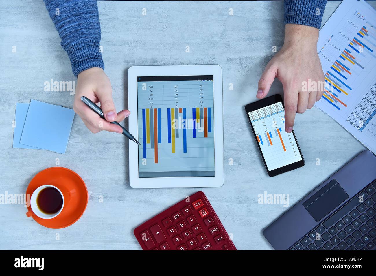 Top view of businessman doing business and charts being demonstrated on ...