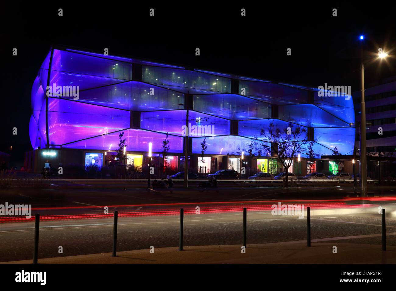 Water Mirror and Le Nuage building by night designed by Philippe Starck ...