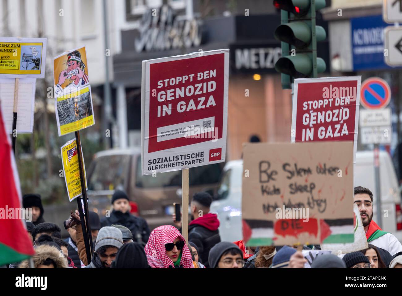 Duesseldorf, Germany. 02nd Dec, 2023. Demonstrators hold up a sign ...