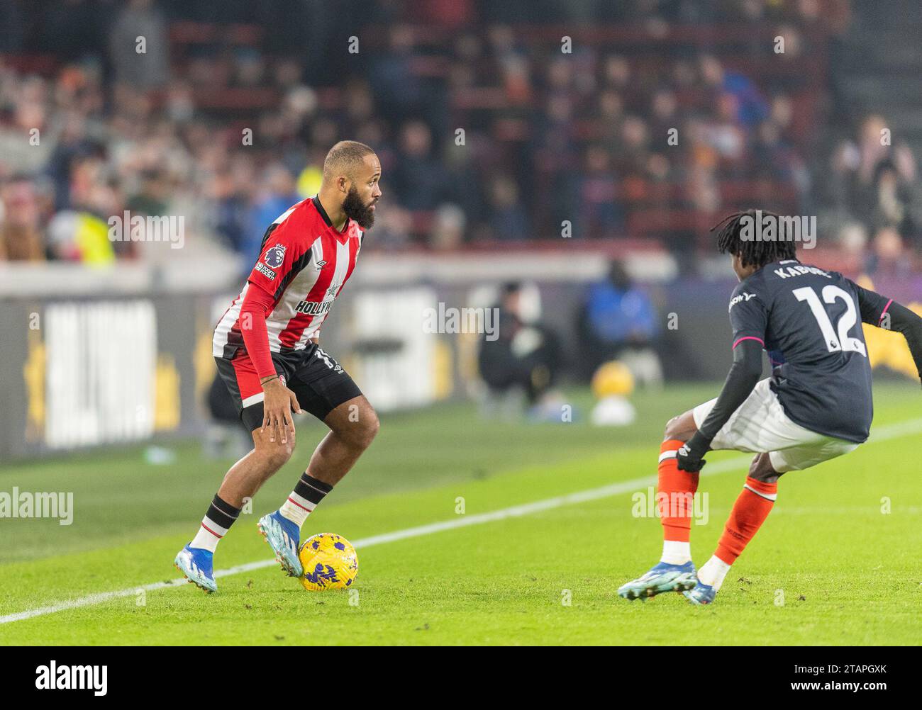 Bryan Mbeumo of Brentford takes on Issa Kaboré of Luton Town during the ...