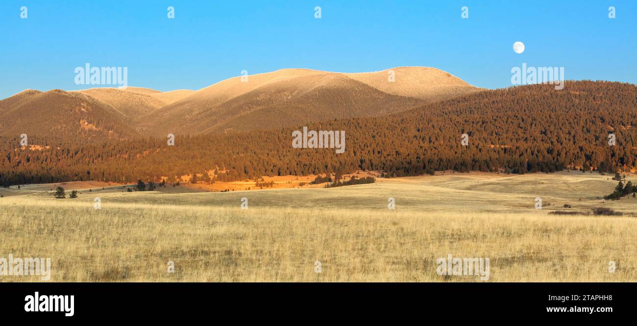 panorama of a full moon rising over the continental divide near avon ...