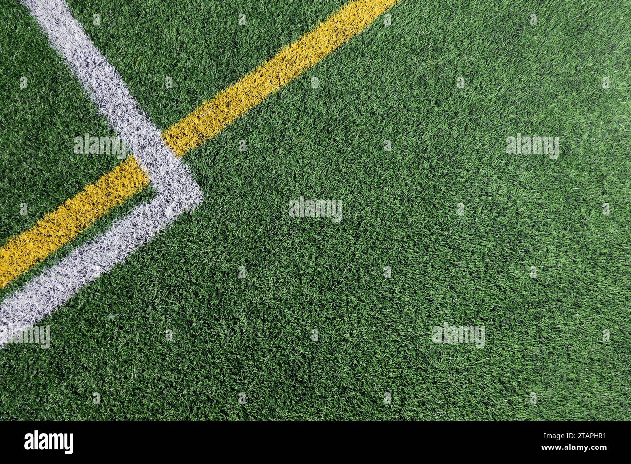 Green artificial grass turf soccer football field background with white ...