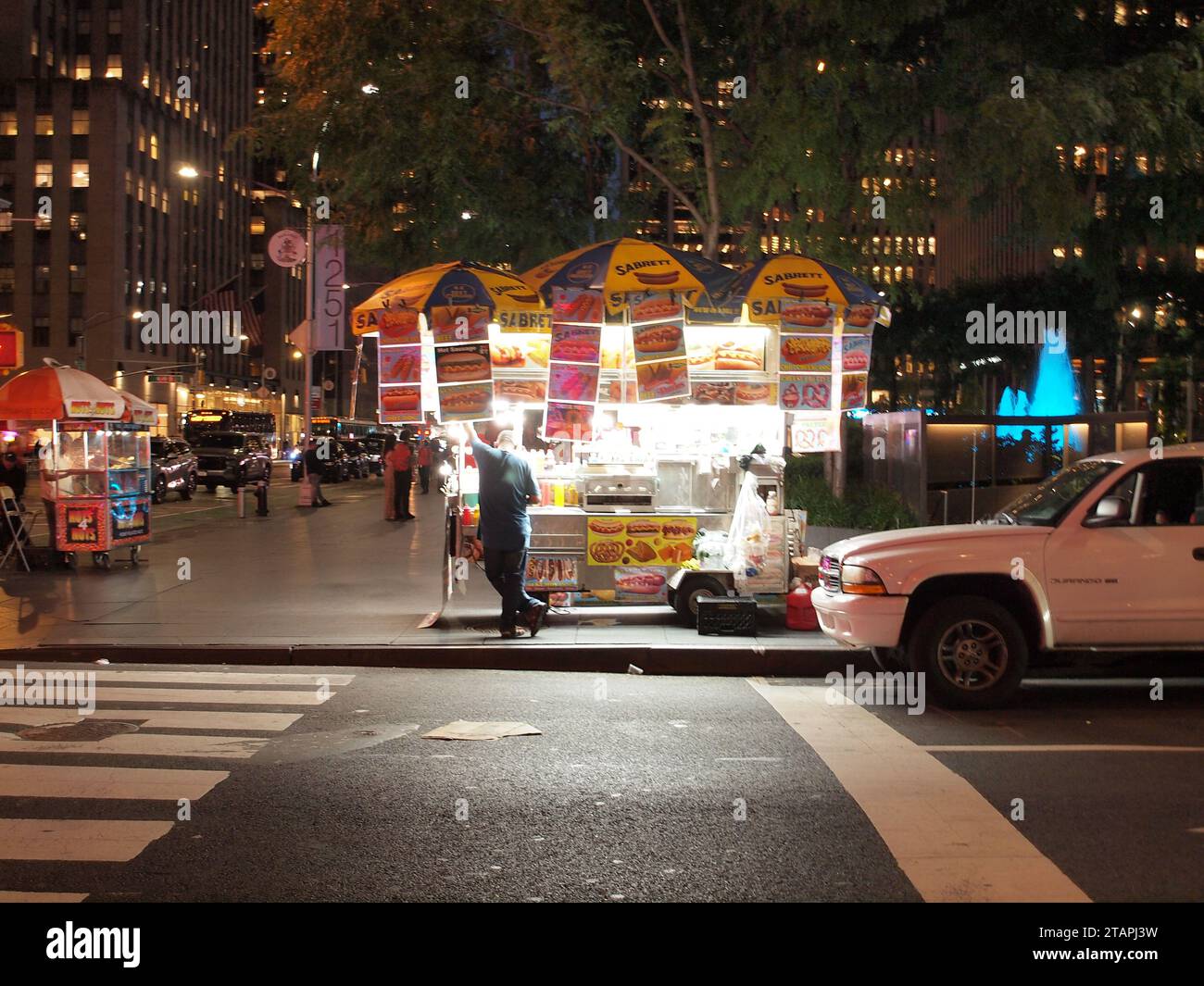 New York City street vendor on a busy Manhattan street corner ready to ...
