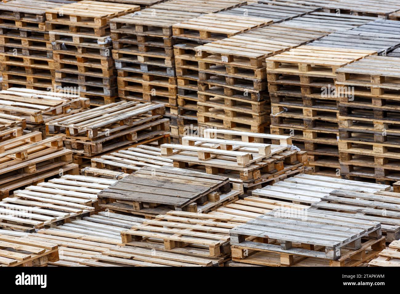 used wooden pallets stacks in outdoors storage Stock Photo - Alamy