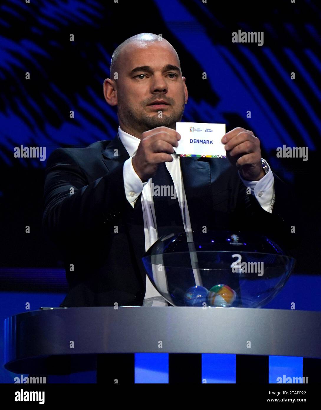 Former Netherland's Wesley Sneijder pulls of the card of Denmark which ...