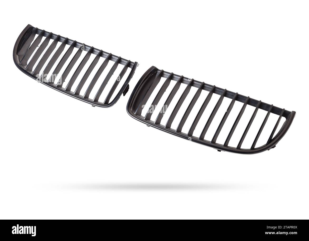 radiator grille on a white background made of shiny chromed metal is an ...
