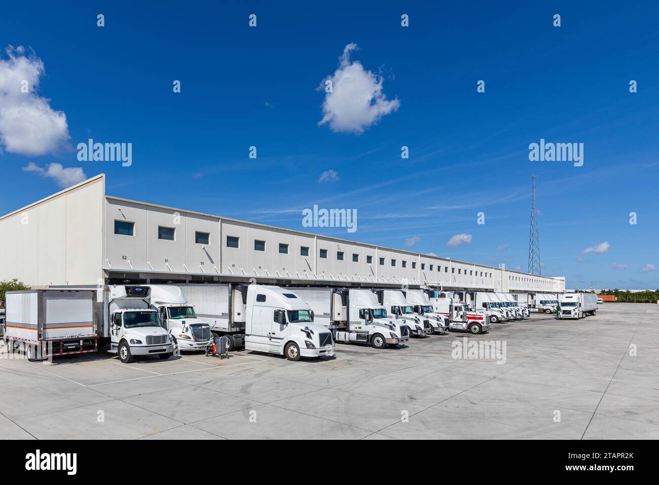Trucks parked at warehouse loading dock area Stock Photo - Alamy